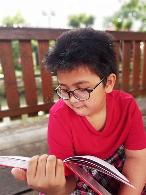 Boy With Glasses Diligently Read Books Stock Image Image Of Clothing