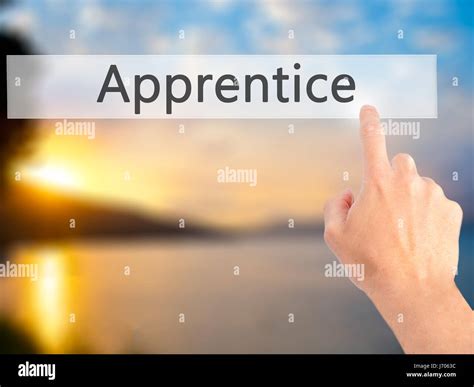 Apprentice - Hand pressing a button on blurred background concept . Business, technology ...