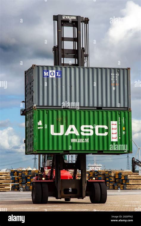 Mobile Container Handler In Action At A Container Terminal In The Port