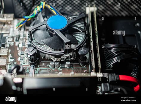 Close Up View Of A Computer Motherboard With A Cooling Fan And Various Electronic Components