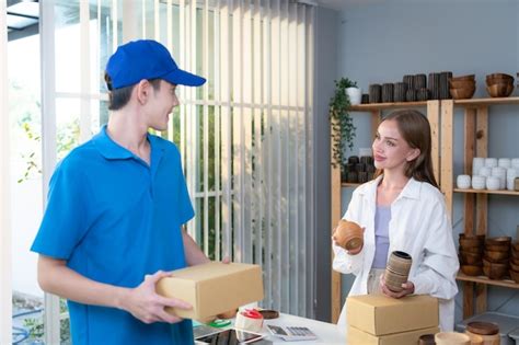 Premium Photo The Delivery Man Brings The Goods That The Customer