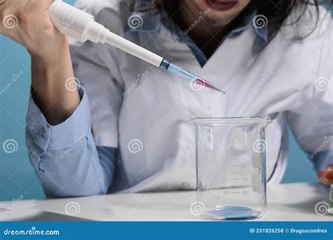 Insane Chemist With Amusing Looks After Failed Laboratory Experiment On Blue Background Stock