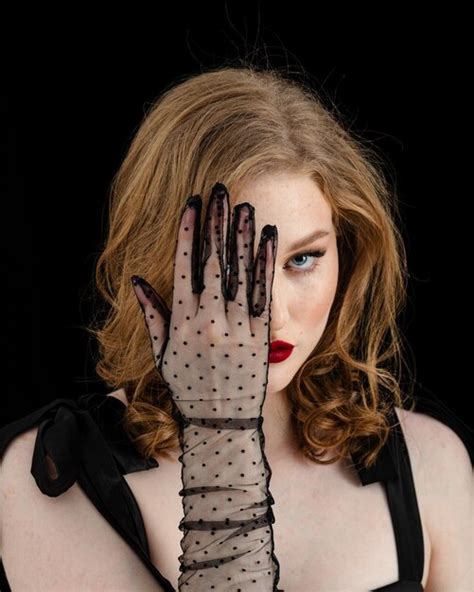 Premium Photo Sexy Young Redhead With Red Lips On A Black Backgrou