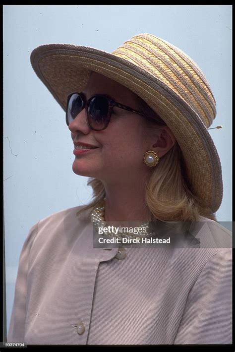Straw Hat And Sunglasses Wearing Hillary Rodham Clinton Poised Smiling