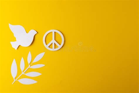 High Angle View Of White Peace Sign White Dove And Leaf With Copy