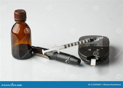 Glucometer And Bottle With Strips On Grey Table Flat Lay Diabetes