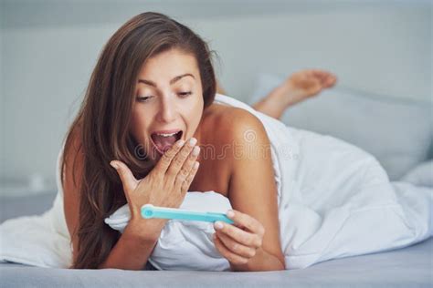 Young Brunette Woman With Pregnancy Test In The Bed Stock Image Image