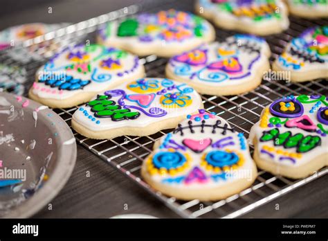 Sugar Cookies In Shape Of Sugar Skull Decorated With Colorful Royal