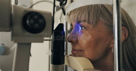 Mature Woman Slit Lamp And Face For Eye Test Or Medical Service With