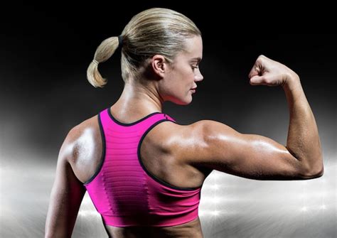 Premium Photo Fit Woman Flexing Muscles