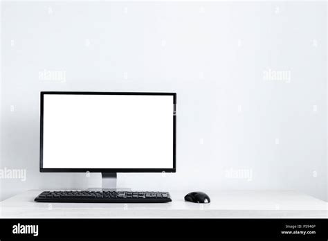 Mockup A Modern Desktop Computer Shows A Blank Screen On The Desk