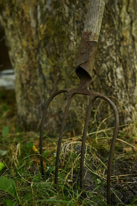 Premium Photo Pitchfork On The Grass Pitchfork Closeup Photo The