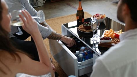 The Amazing Coffee Table That Chills Beer And Charges Phones Is Now