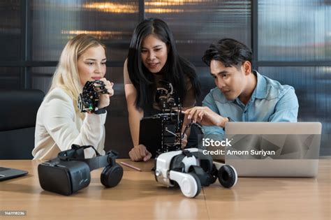 Male And Female Engineer Working With Ai Robot Arm System Project In