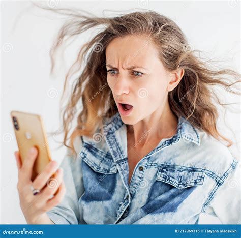 Surprised Woman Looking At Mobile Phone Stock Image Image Of