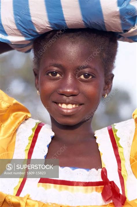 African Girl Carrying Sack On Head Banjul Gambia Superstock