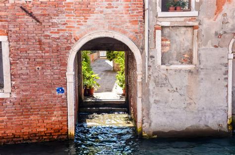 A Brick Building With A Doorway And A Small Archway Stock Image Image