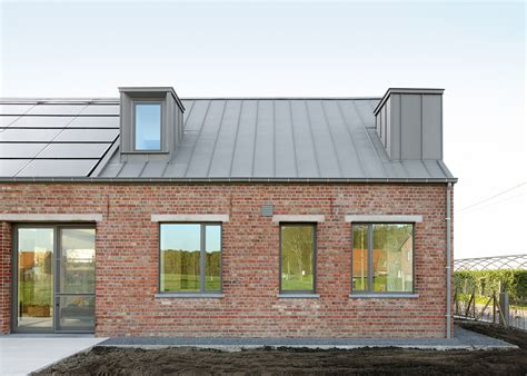 Atelier Tom Vanhee Adds Gabled Wooden Extensions To Brick Farmhouse