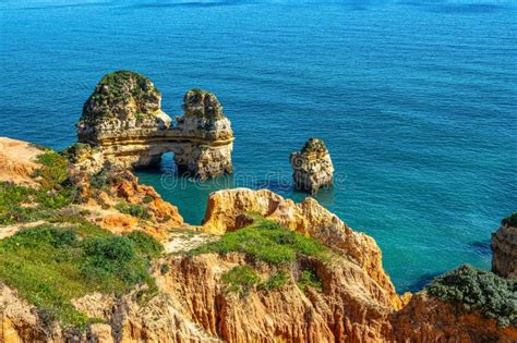 Ponta Da Piedade Is A Unique Rock Formation With Famous Grottos In The