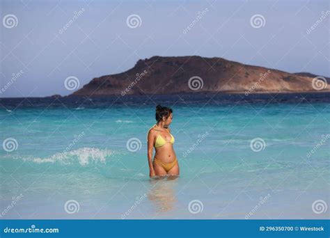 Beautiful Southeast Asian Woman In A Bikini Standing In The Shallow