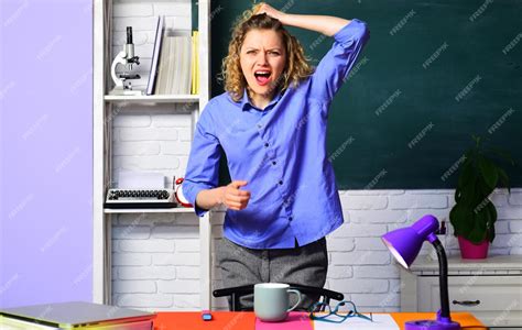 Premium Photo Screaming Young Teacher In Classroom Angry Female