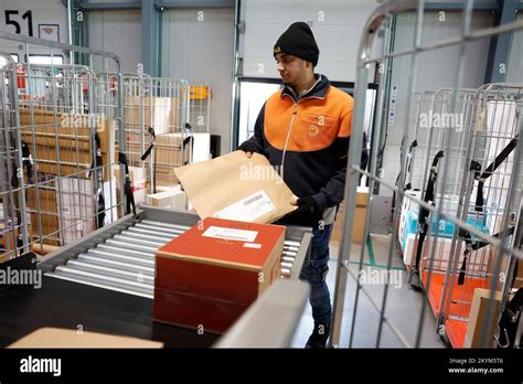 Westzaan Employees Of Post And Parcel Delivery Company Postnl Sort Parcels In The Parcel