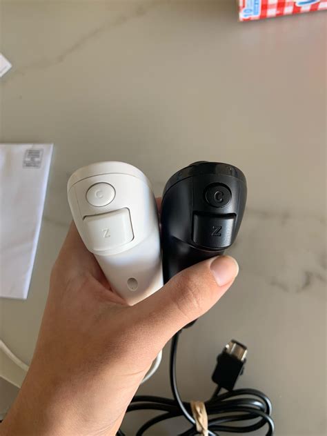 i m not convinced this black wii nunchuk is oem the buttons are weird and there s no nintendo