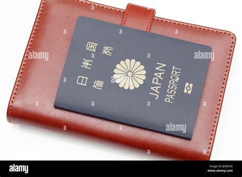Japanese Passport And Leather Notebook Isolated On White Background