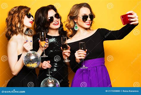 Close Up Shot Of Group Of Laughing Girls Having Party Take Selfie With