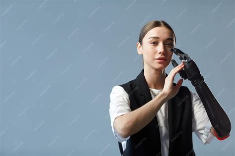 Premium Photo Portrait Of Young Woman With Prosthetic Arm Looking At