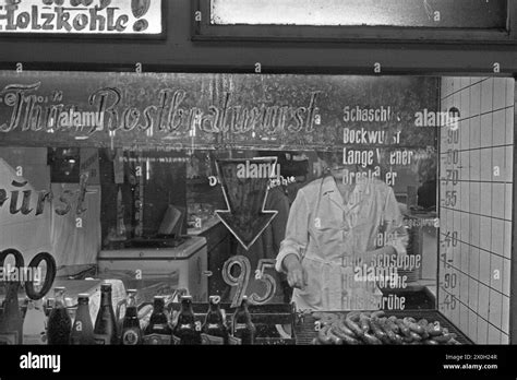 A Bratwurst Stand With Menu And Prices Written On The Window On The Kurfuerstendamm In Berlin