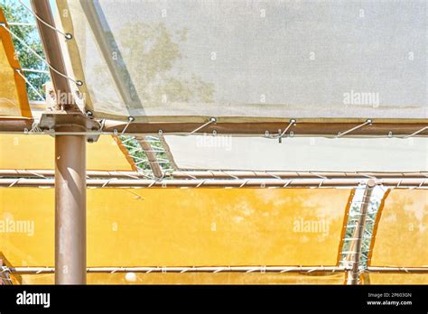 Orange Canopy Over Sun Loungers In Recreation Area Of Water Park