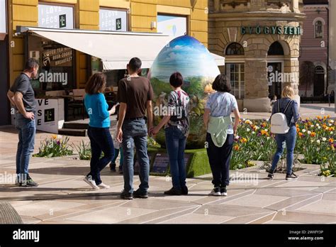 Pecs 30th Mar 2024 People Look At A Two Meter Tall Easter Egg