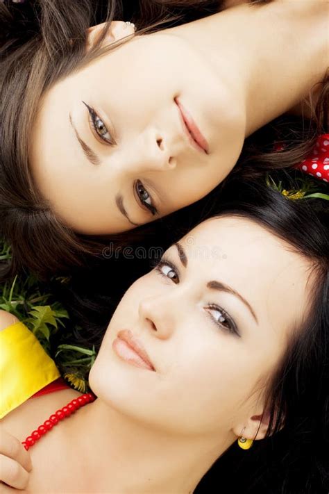 Beauty Two Women Together At Home On Bed Wearing Lingerie Looking