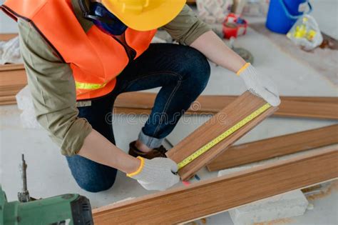 Structural Worker Dressed In Safety Gear And Hard Hat Doing