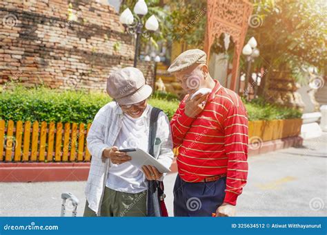 Closeup Senior Chinese Tourist Couples Are Looking Digital City Maps In Tablet Computer To Find