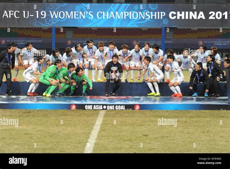Players Of Japan Pose For Photos With Their Trophy After Defeating Dpr