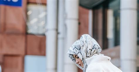 Serious Young Arab Woman Doing Assignment Near University Building