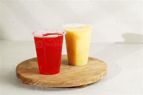 Red Water Melon And Mango Juice On Wooden Board Served With Sealed