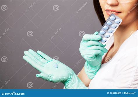 Sexual Health A Doctor In A White Coat Holding A Pill For A Healthy