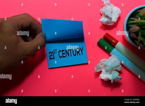 21th Century Write On Sticky Notes Isolated On Pink Table Background