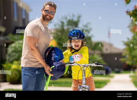 Father And Son In A Helmet Riding Bike Little Cute Adorable Caucasian