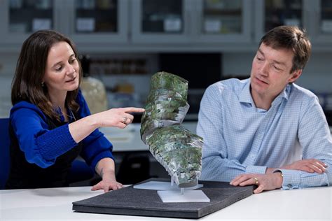 Conservator Bethan Bryan And Curator Dr Fraser Hunter With The Roman Arm Guard Photo C Duncan
