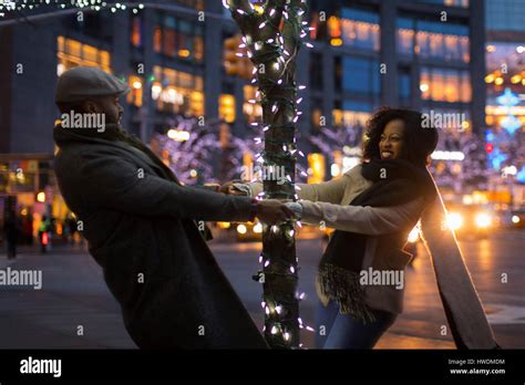 Couple Holding Hands Around Tree Hi Res Stock Photography And Images Alamy