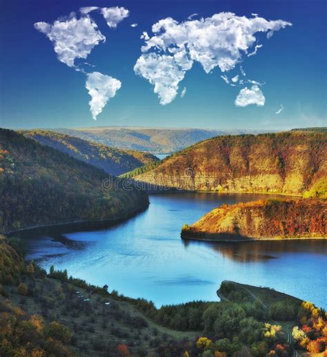 Clouds In The Form Of A World Map Over The River Canyon Travel And Landscape Concept Stock