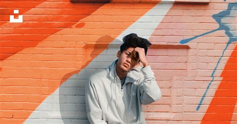 Selective Focus Photography Of Man Sitting Black Armless Chair Photo Free Style Image On Unsplash