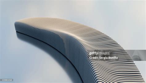 Curved Structure With Repetitive Patterns Against A Blue Background
