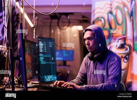 Asian Hacker Cracking Password To Get Illegal Access To Database Confidential Information Young