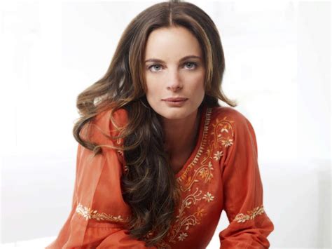 Download Graceful Gabrielle Anwar Posing In A Stylish Outfit Wallpaper