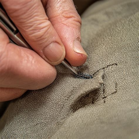 A Person Using A Seam Ripper To Remove Incorrect Stitching Premium Ai
